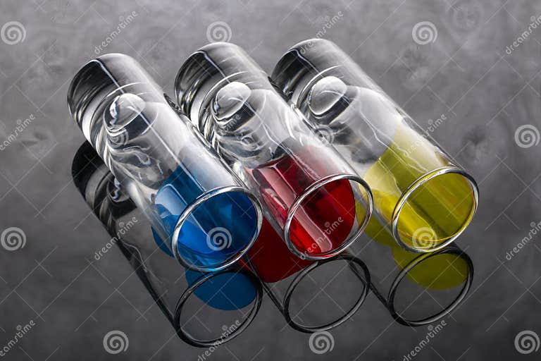 Still Life with Glass Objects with Colored Spots on a Reflective ...