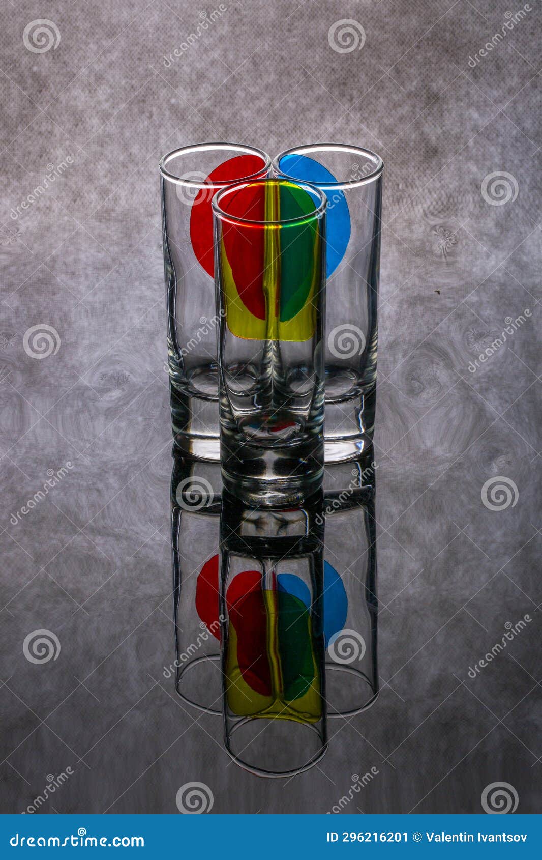 Still Life with Glass Objects with Colored Spots on a Reflective ...
