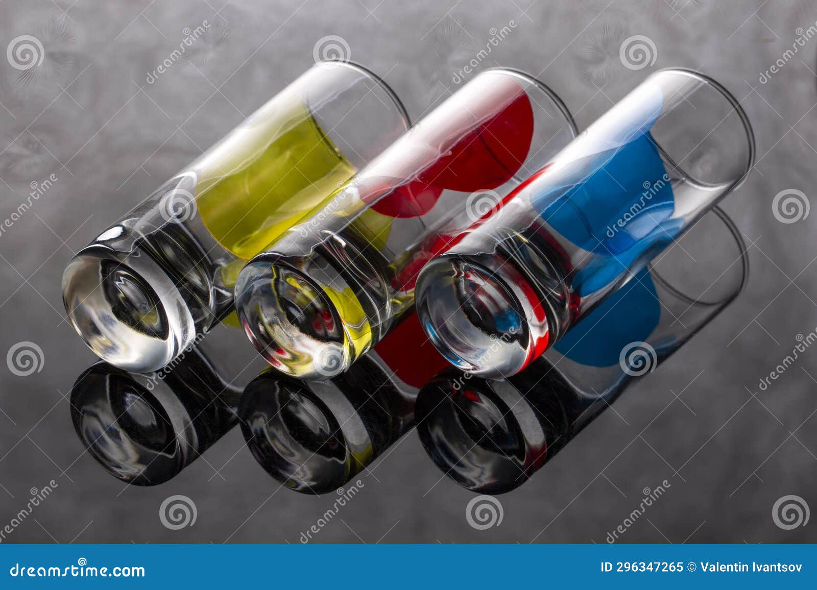 Still Life with Glass Objects with Colored Spots on a Reflective ...