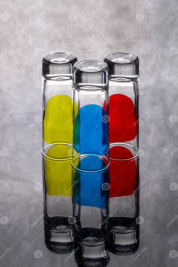 Still Life with Glass Objects with Colored Spots on a Reflective ...