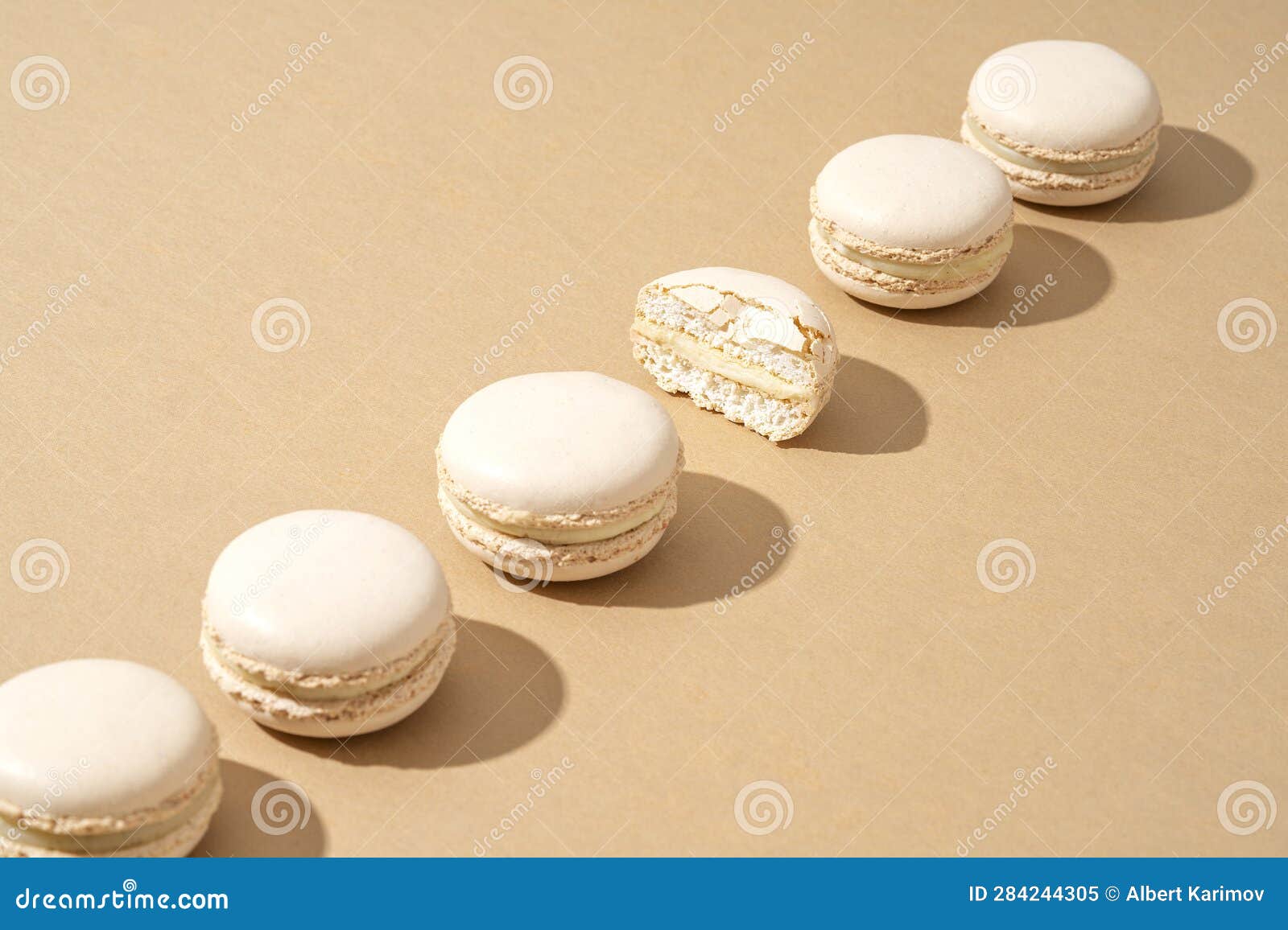 Still Life Image Featuring Six White Macarons, Arranged in a Stack on ...
