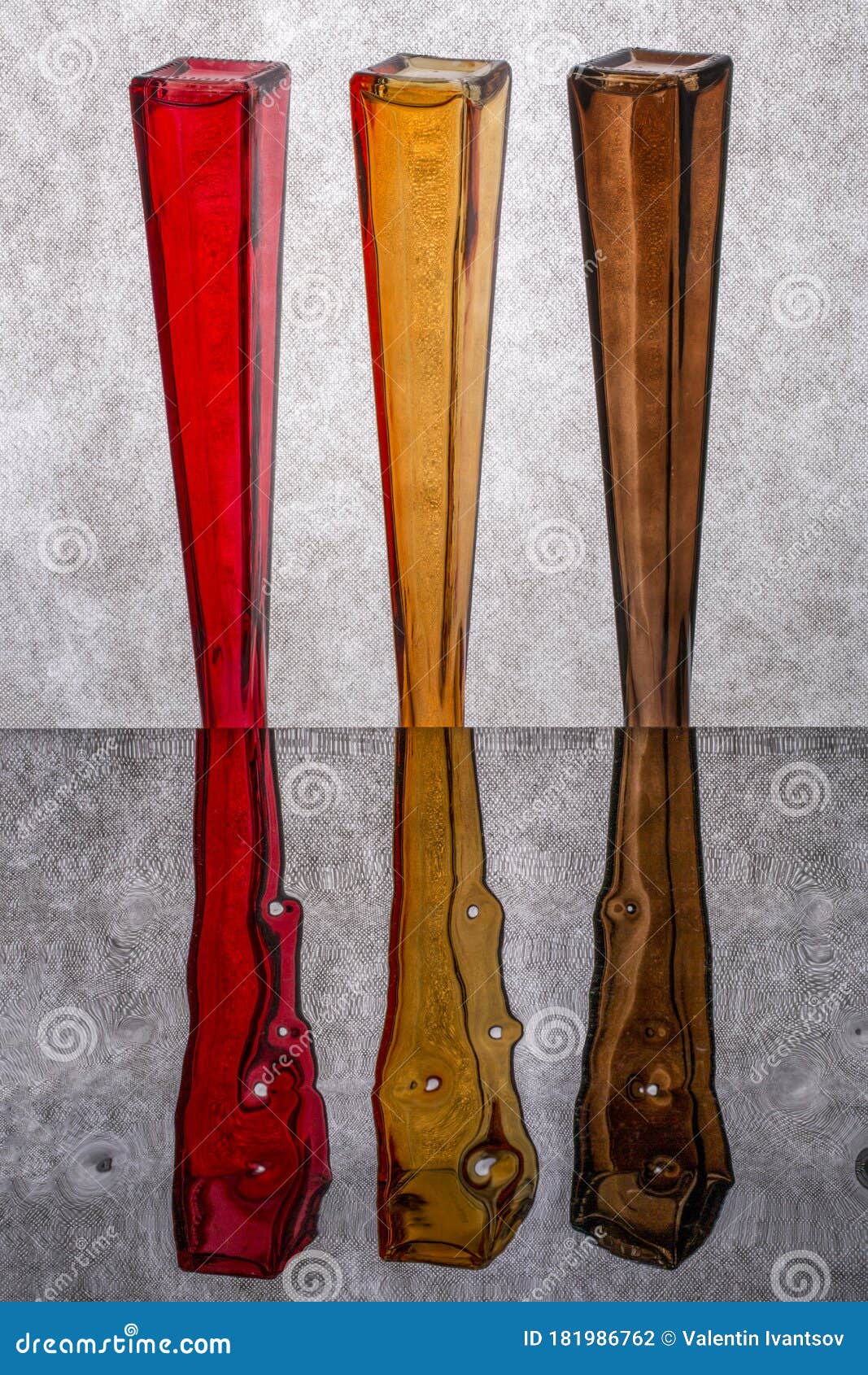 Still Life with Inverted Colored Bottles on a Reflective Surface Stock ...