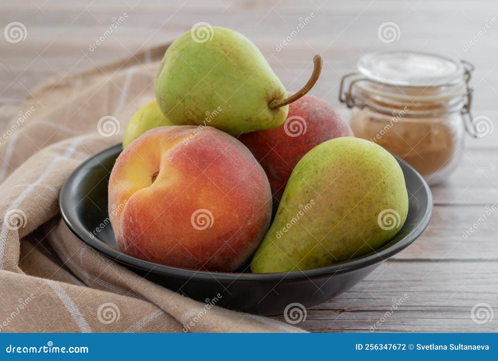 Still Life with Pears and Peaches in a Black Bowl on a Wooden Table ...