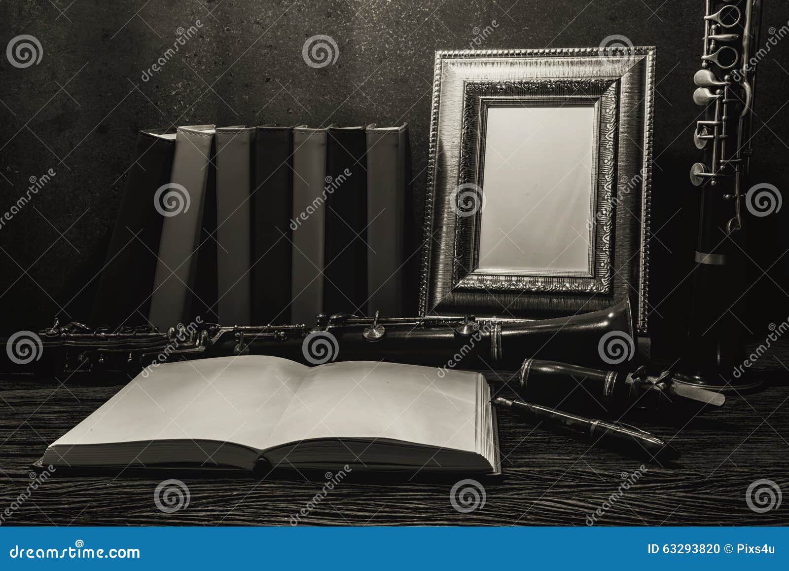 Still Life of Picture Frame on Wooden Table with Clarinet Stock Photo ...