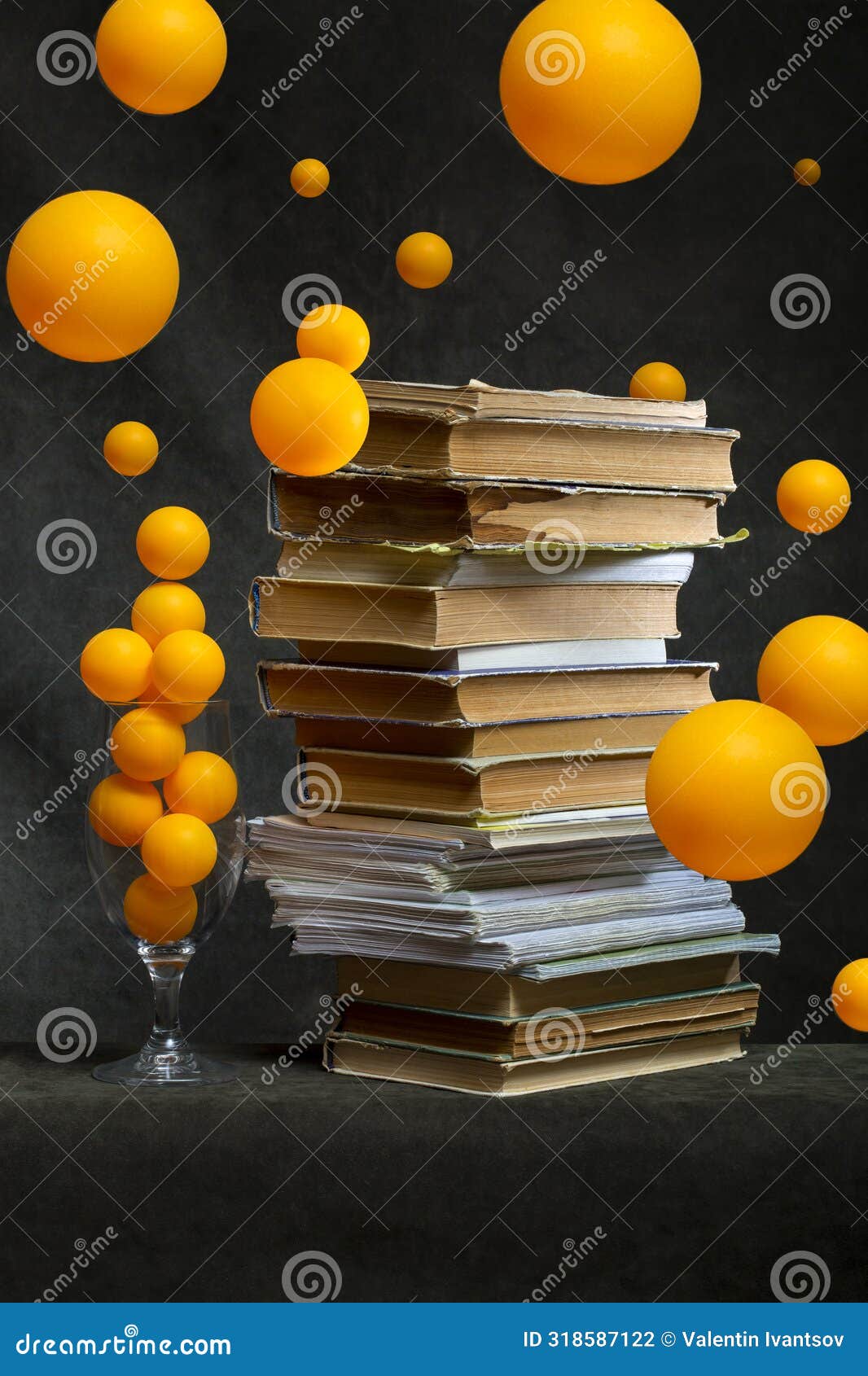 Still Life with a Stack of Books and Orange Balloons Stock Photo ...