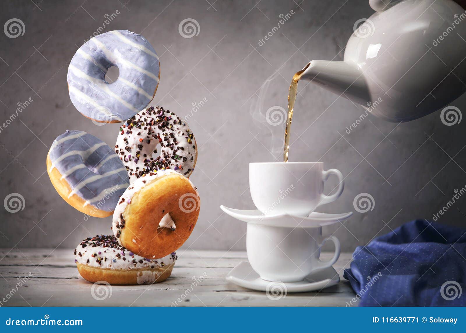 Still Life with Tea and Falling Down Donuts Stock Image - Image of ...
