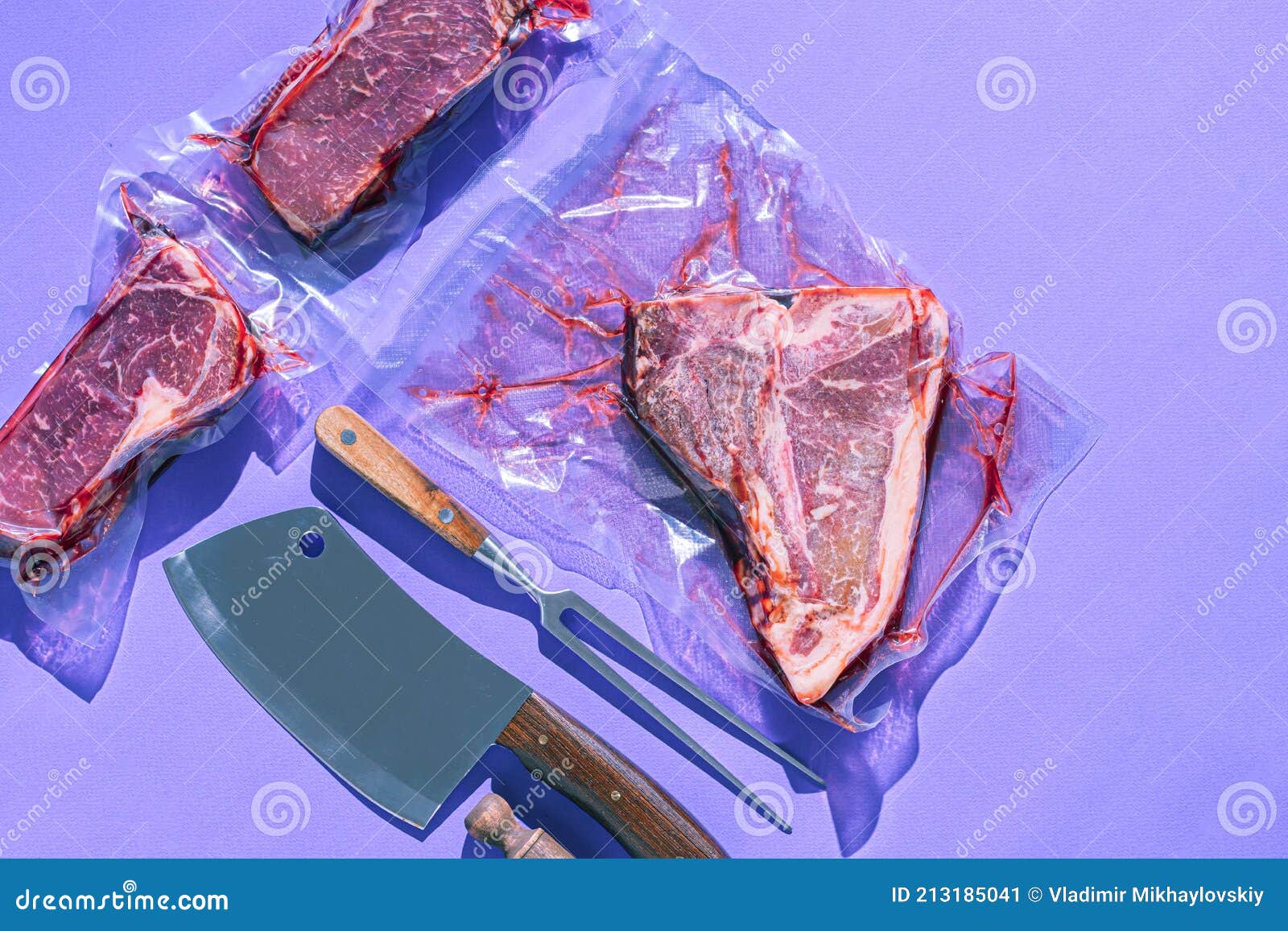 Still Life of Vacuum-packed Meat with Herbs and Butcher`s Tools Stock ...