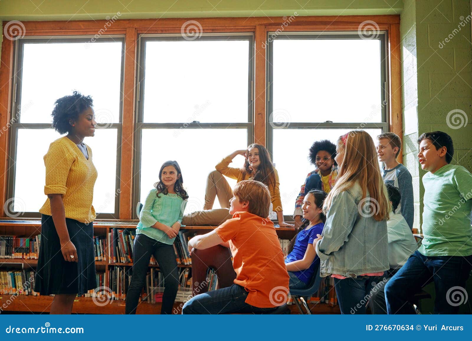 Stimulating Young Minds. a Young Teacher Educating a Group of Elementary Children. Stock Photo ...