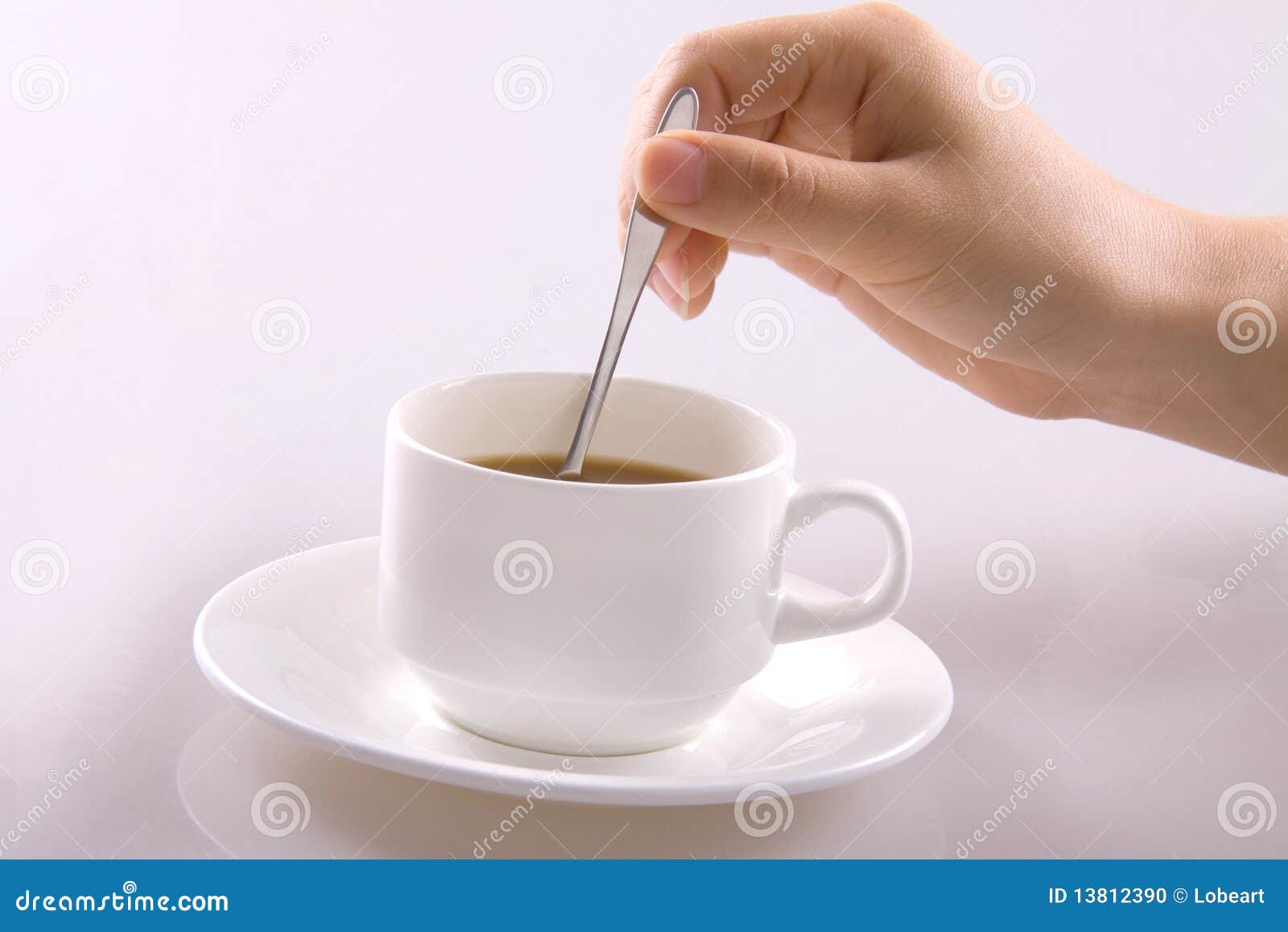 Stir coffee stock photo. Image of fingers, porcelain - 13812390