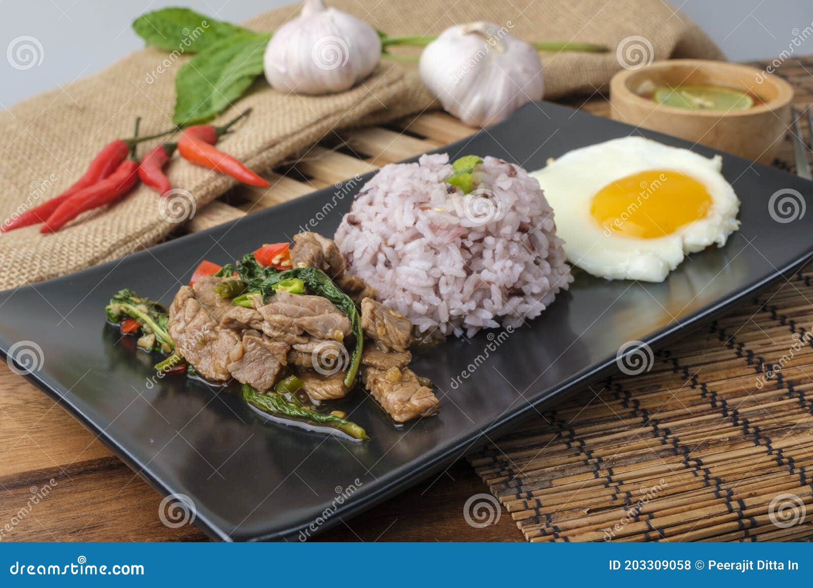 Stir-fried Beef Basil with Fried Egg and Riceberry Rice Stock Photo ...