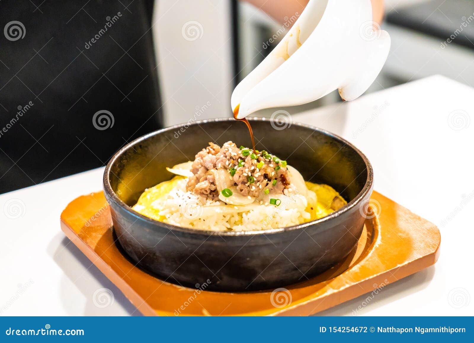 Stir-fried Beef on Rice with Egg Stock Photo - Image of donburi, green ...