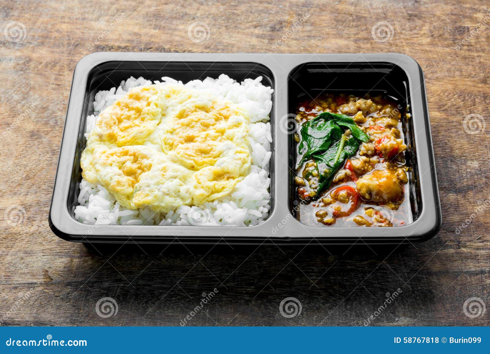 Stir Fried Chicken with Basil Over Rice and Omelette Stock Photo ...