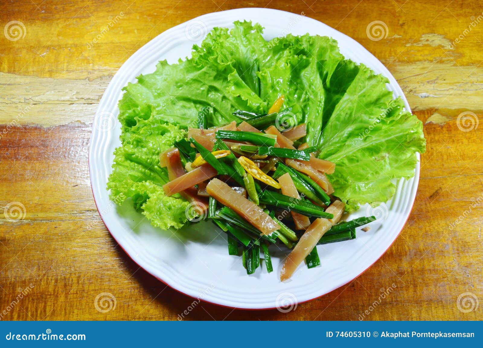 Stir Fried Pickled Crispy Squid with Garlic Chives and Lettuce on Dish ...