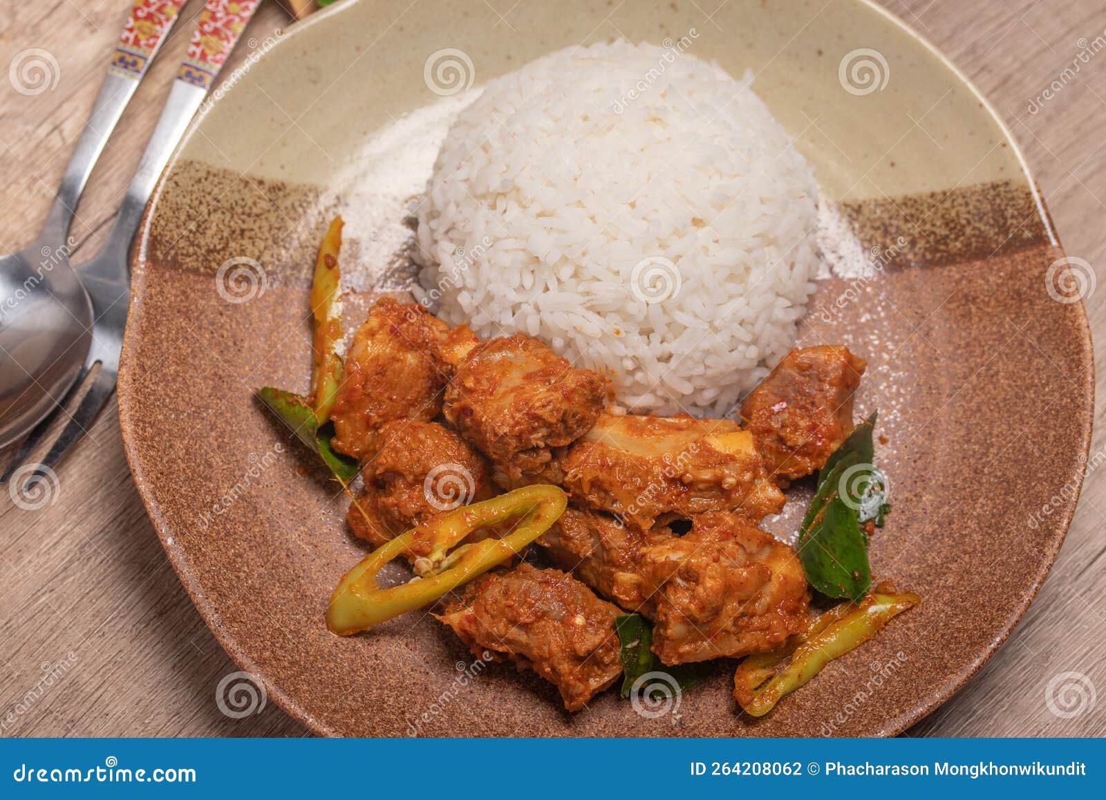 Stir-fried Pork Ribs with Curry Paste and Steamed Rice Stock Photo ...