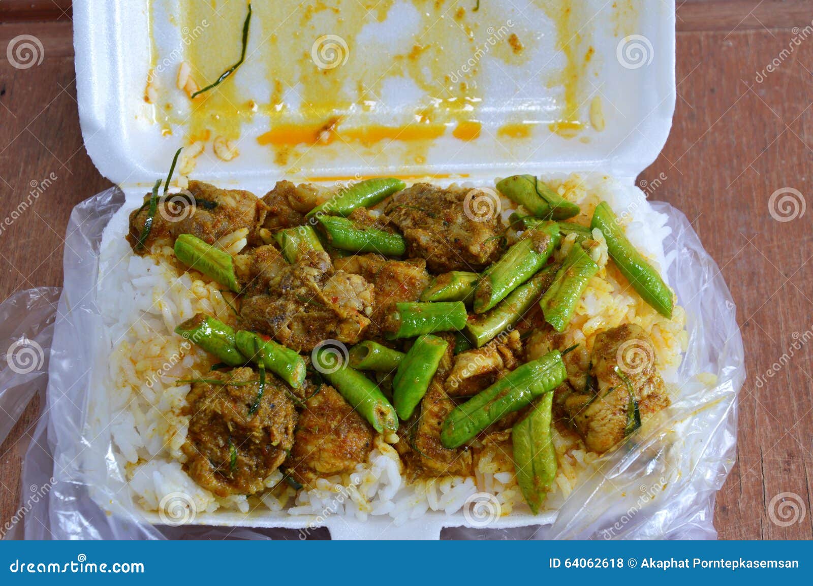 Stir-fried Spicy Curry with Crispy Chicken on Rice in Foam Box Stock ...