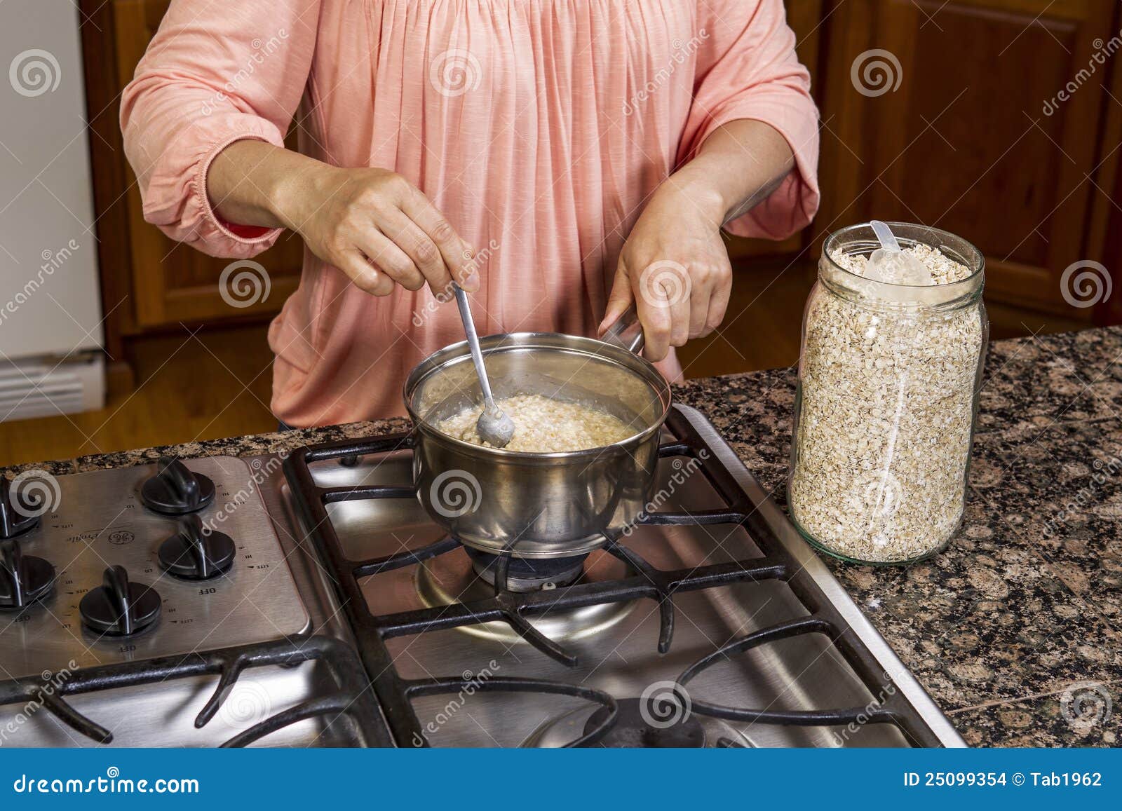 Stirring Oatmeal for Breakfast Stock Photo - Image of stir, range: 25099354