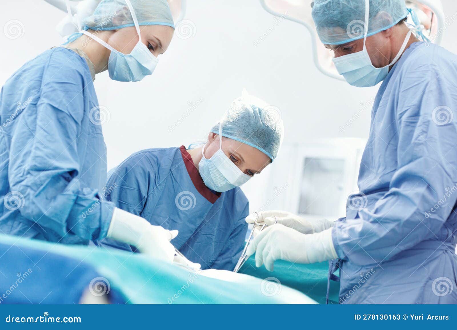 A Stitch in Time. Surgeons Using Medical Tools and Forceps To Operate ...