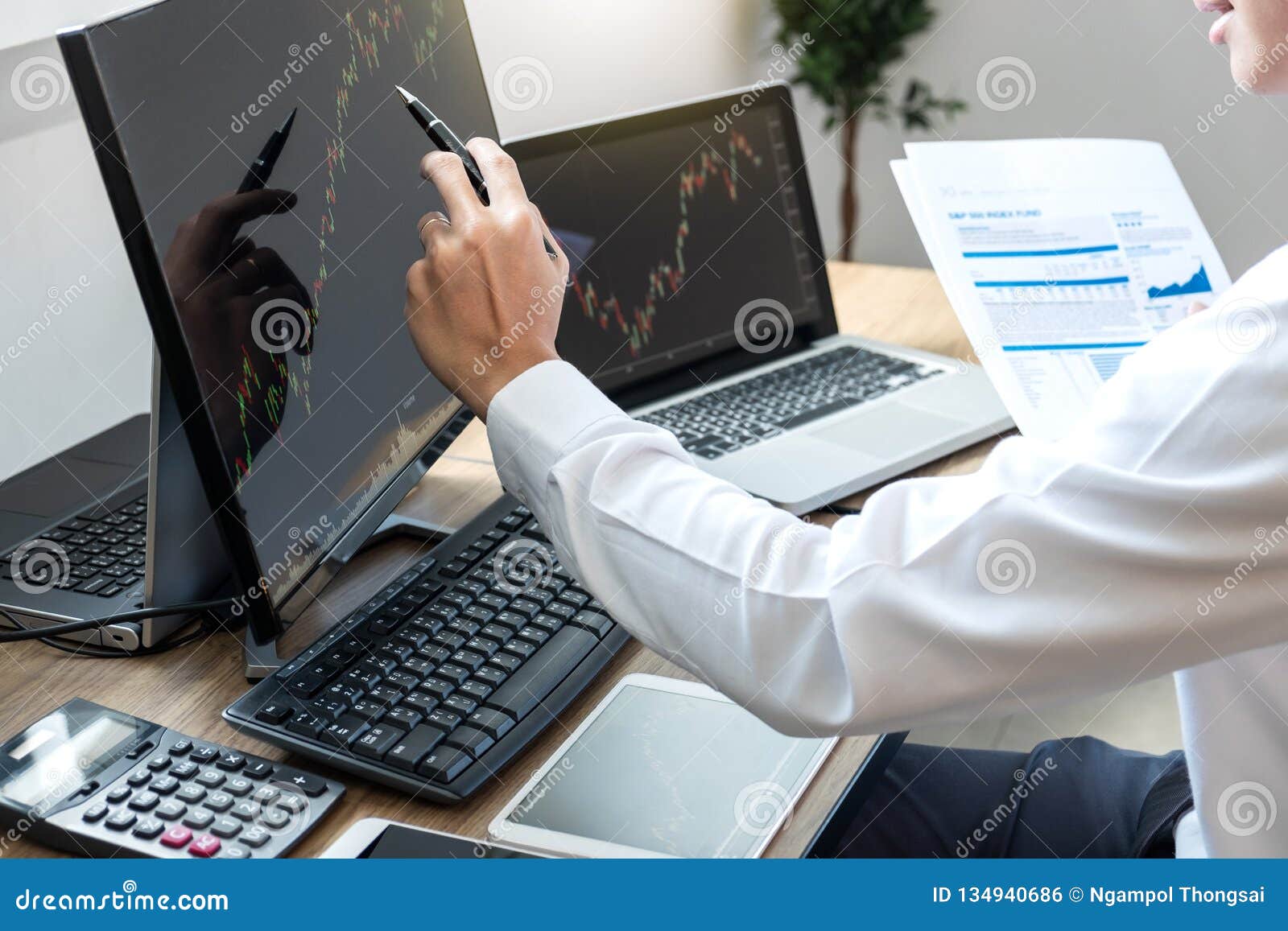 Stock Exchange Market Concept, Stock Broker Looking at Graph Working ...