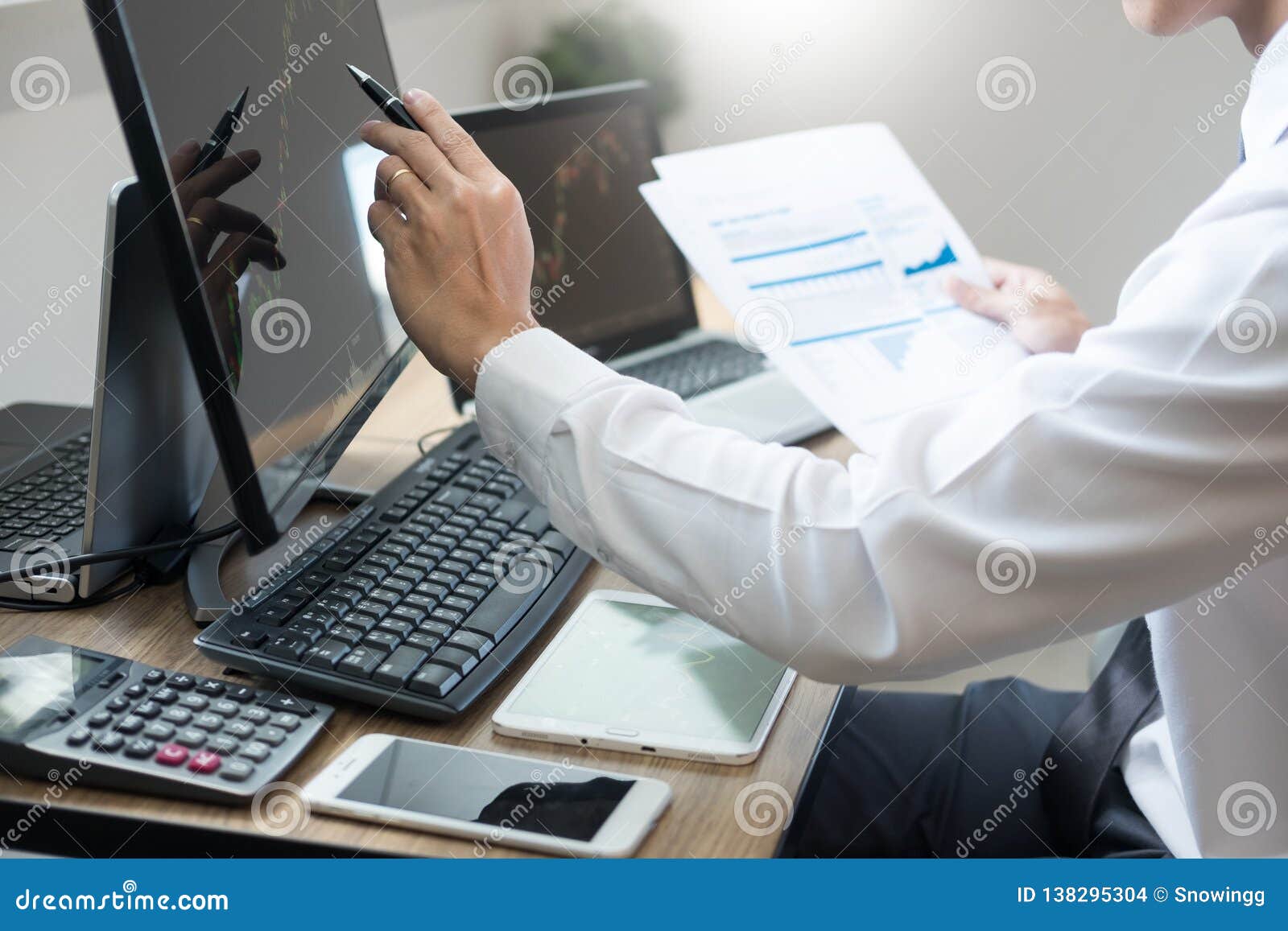 Stock Exchange Trader Analyzing Graphs Chart or Data on Multiple ...