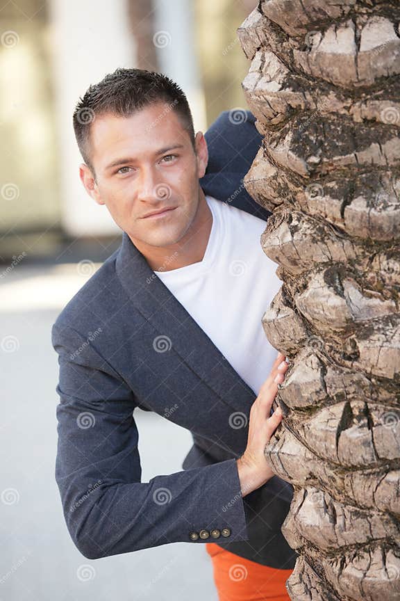 Stock Image of a Man Behind a Tree Stock Photo - Image of attractive ...