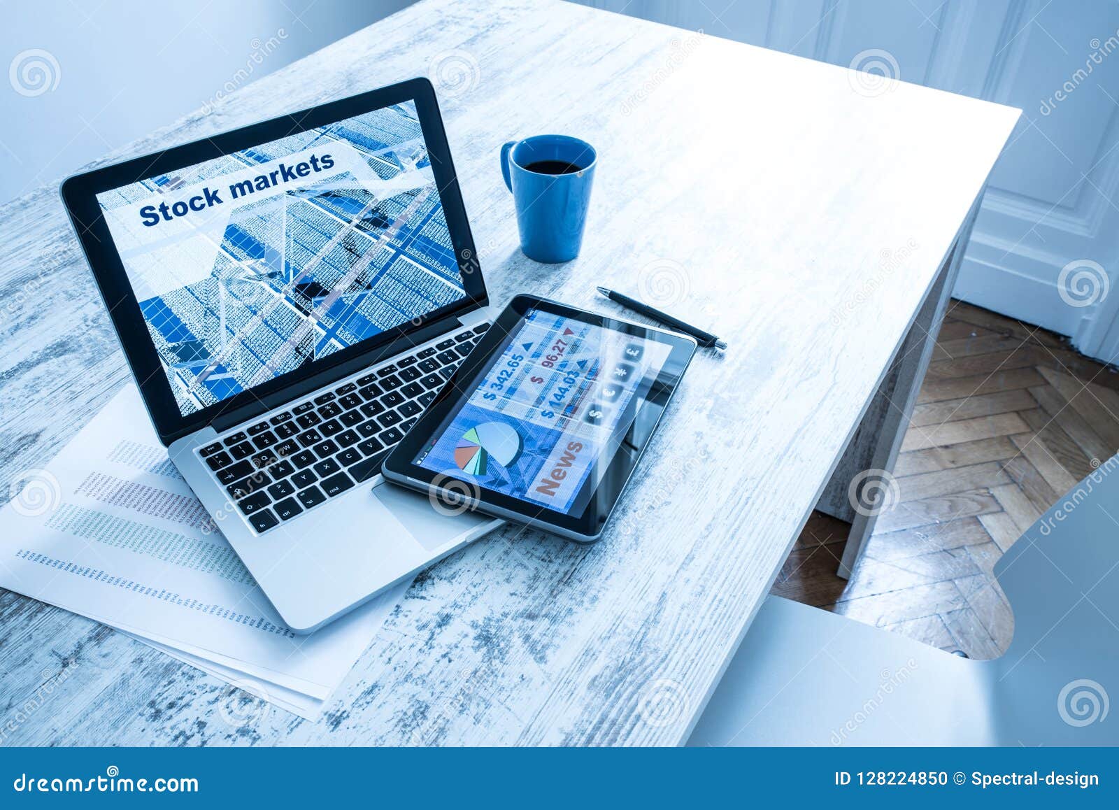 Stock Market Trading App on a Tablet PC and Laptop PC Stock Photo ...