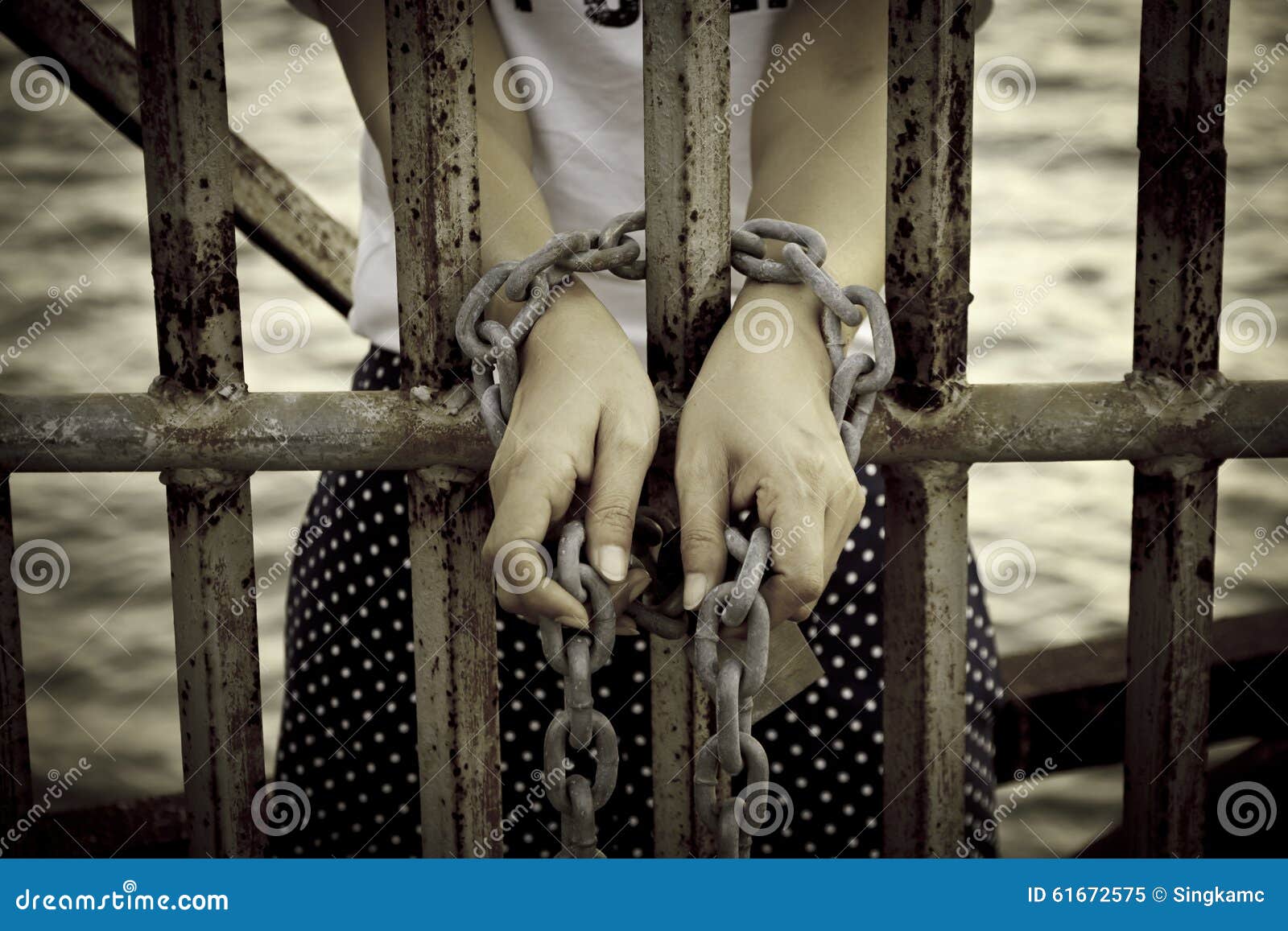 Stock Photo:Rusty Chains, Shackles Binding the Hands of a Prett Stock ...