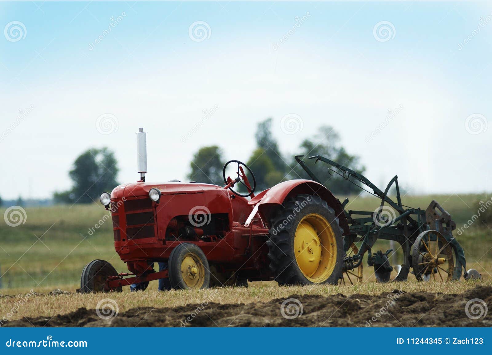 Stock Photo of a Tractor in a Field Stock Image - Image of organic ...
