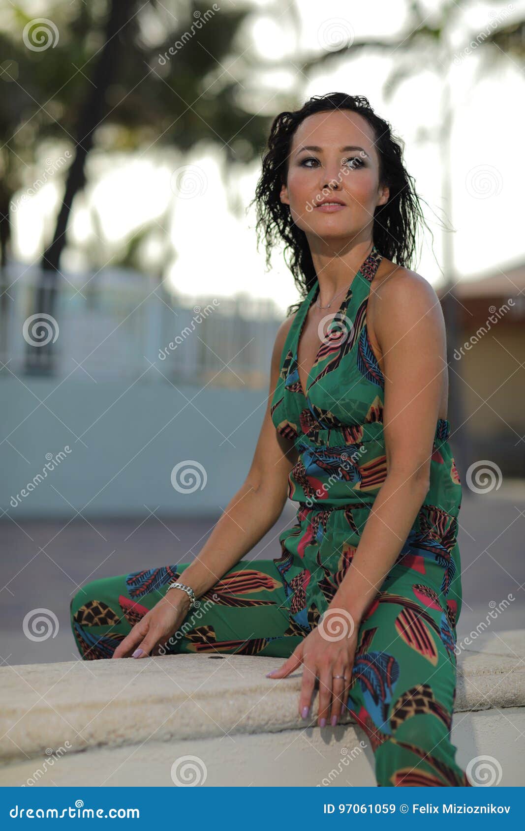 Beautiful Woman Sitting And Glancing Away From Camera Floral Pat Stock