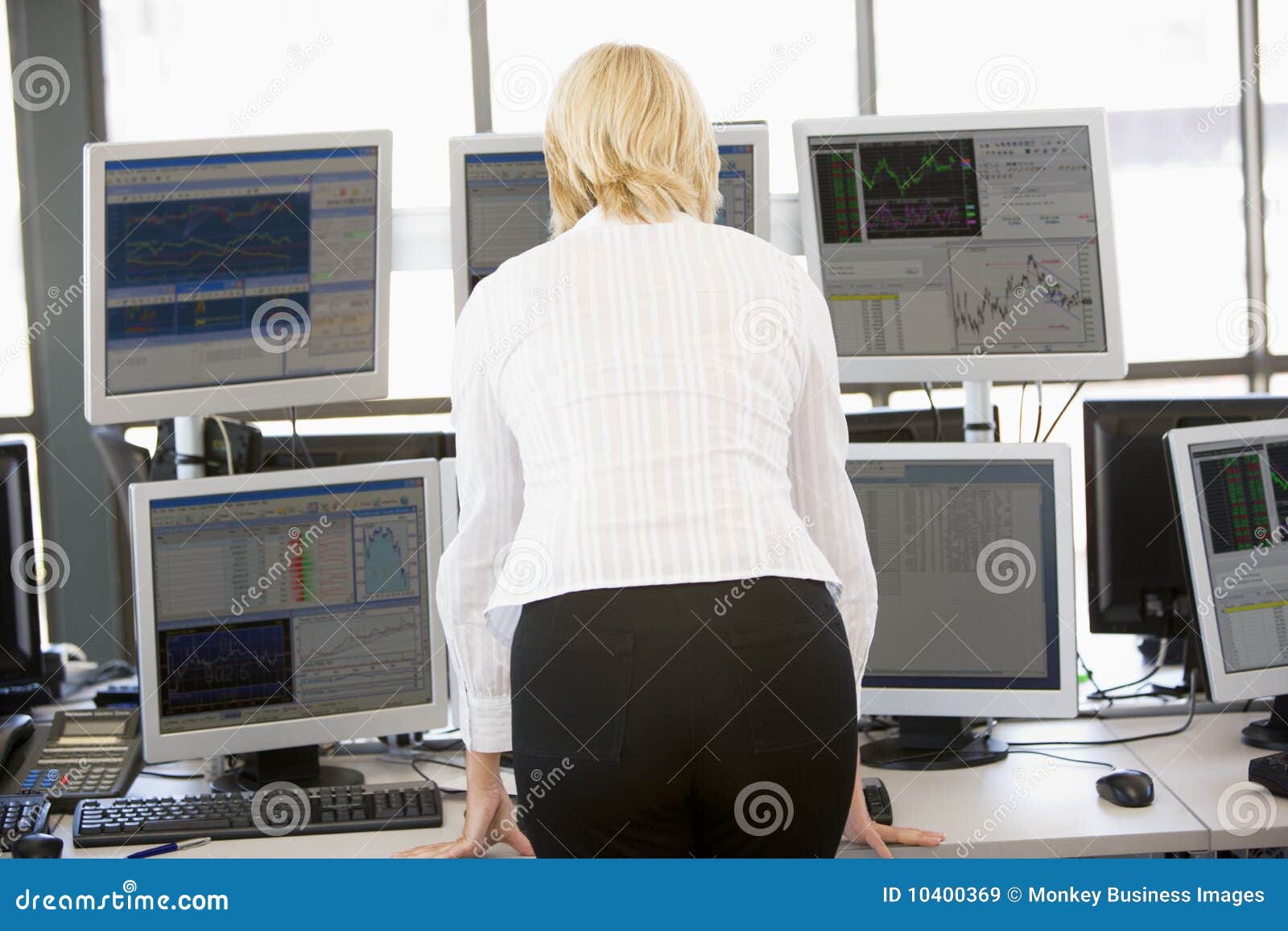 Stock Trader Looking at Multiple Monitors Stock Image - Image of ...
