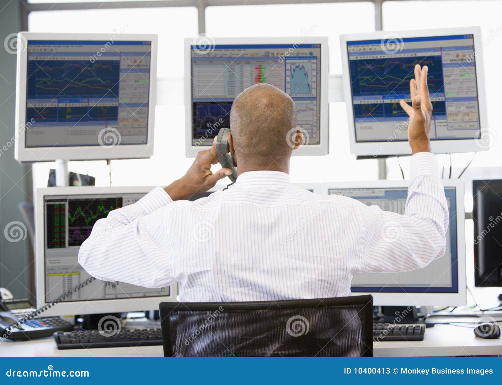 Stock Trader Talking Animatedly on the Phone Stock Image - Image of ...