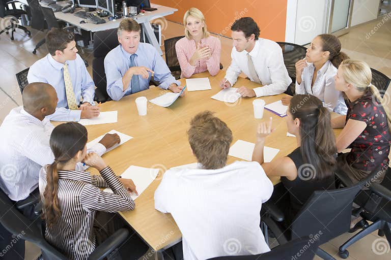 Stock Traders in a Meeting stock image. Image of discussing - 10400271