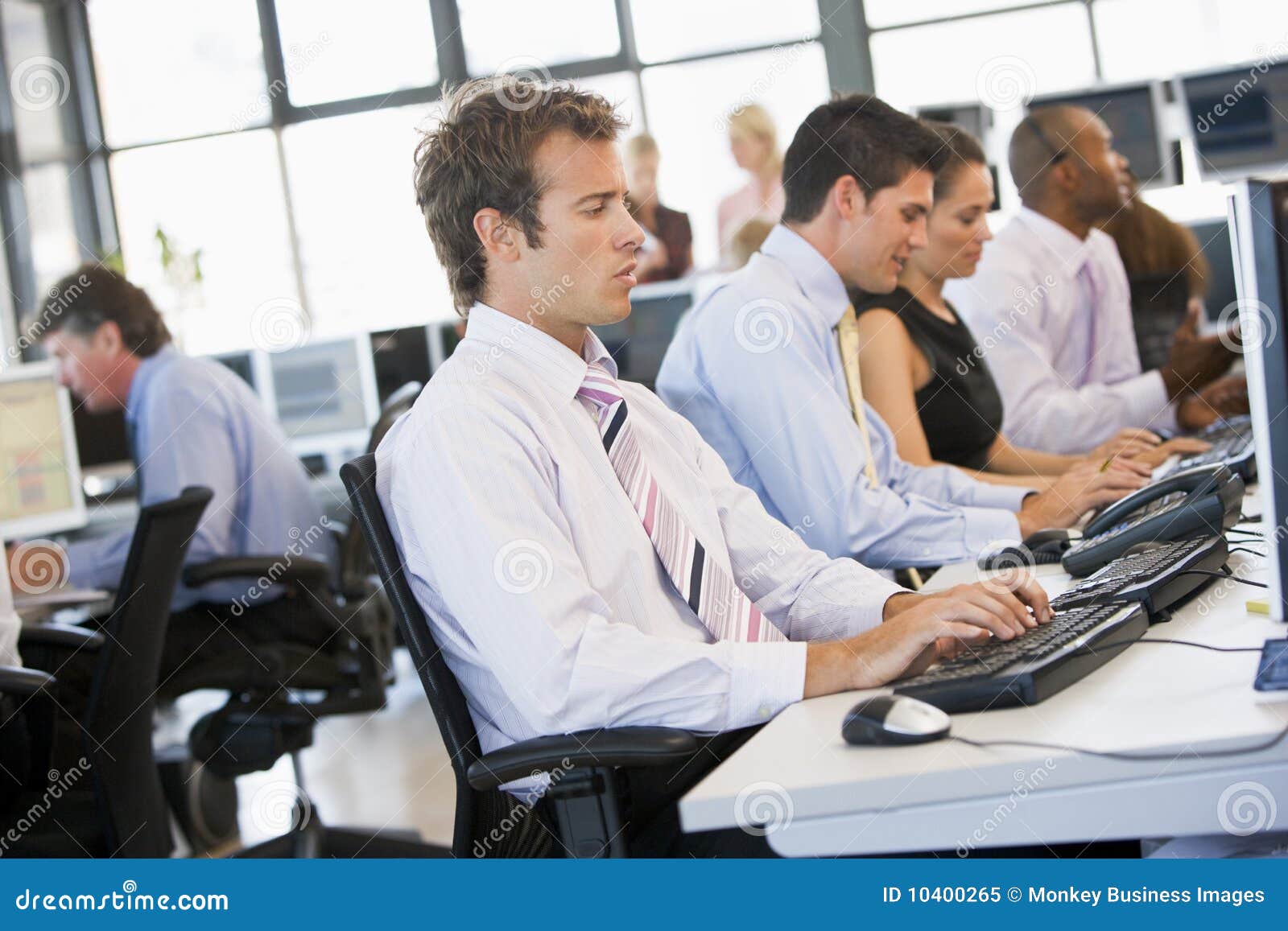 Stock Traders at Work stock image. Image of group, sitting - 10400265