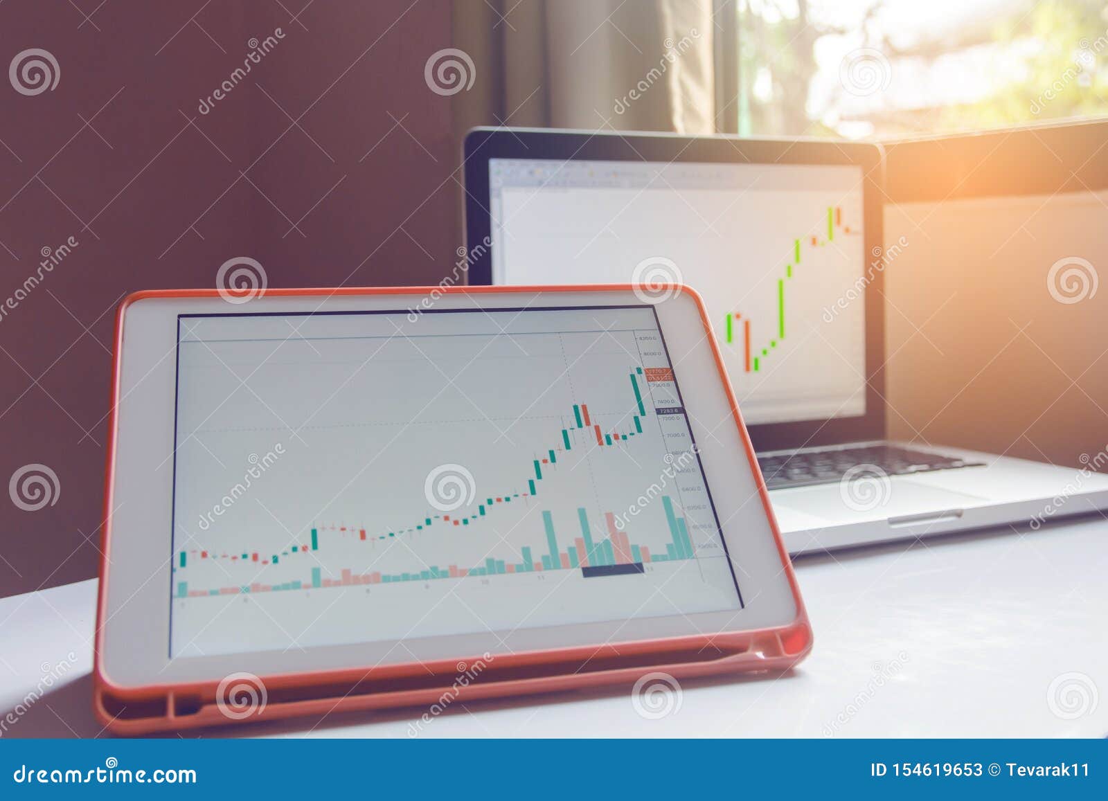 Stock Trading Forex on Tablet and Laptop on a White Table Stock Image ...