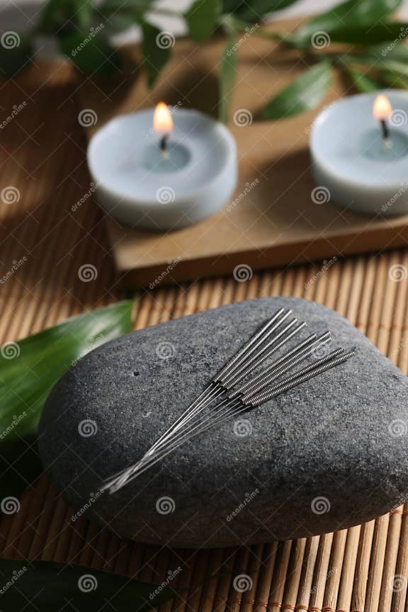 Stone with Acupuncture Needles on Bamboo Mat Stock Image - Image of ...