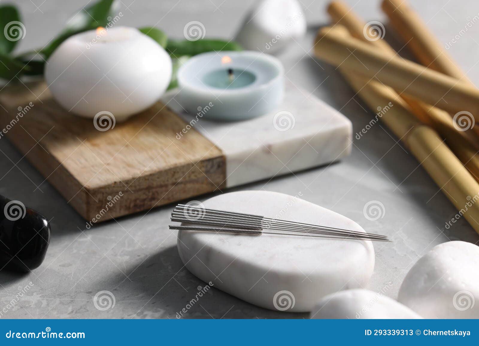 Stone with Acupuncture Needles on Light Grey Marble Table Stock Image ...