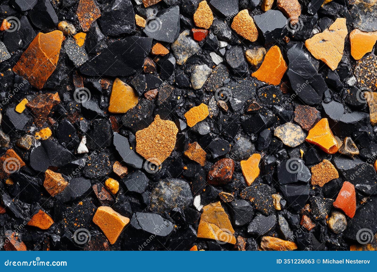 Stone Aggregate Featuring a Mix of Black and Gold Pieces Forms a Rough ...