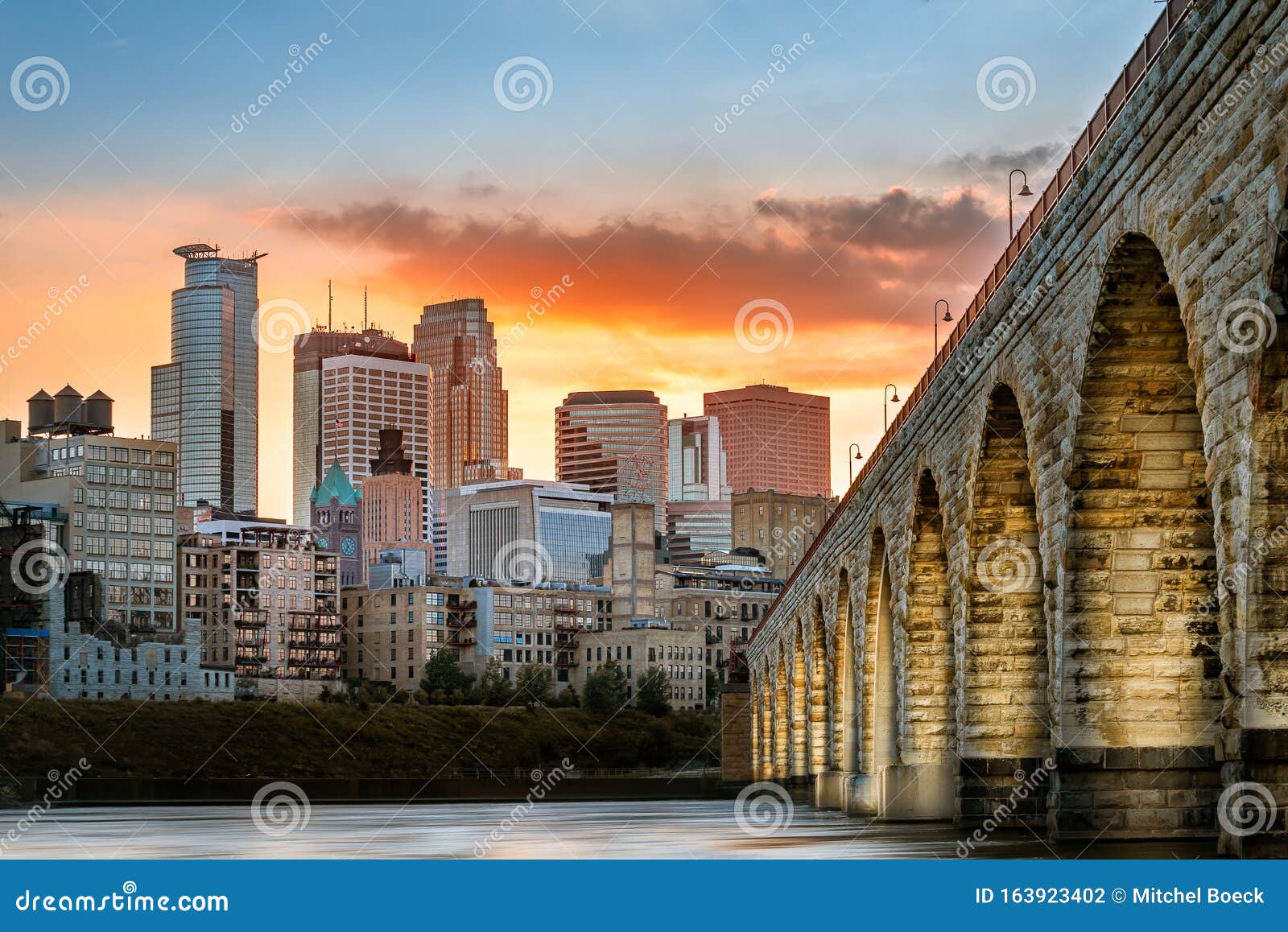 Stone Arch Bridge Lights in Minneapolis at Sunset Stock Photo - Image ...