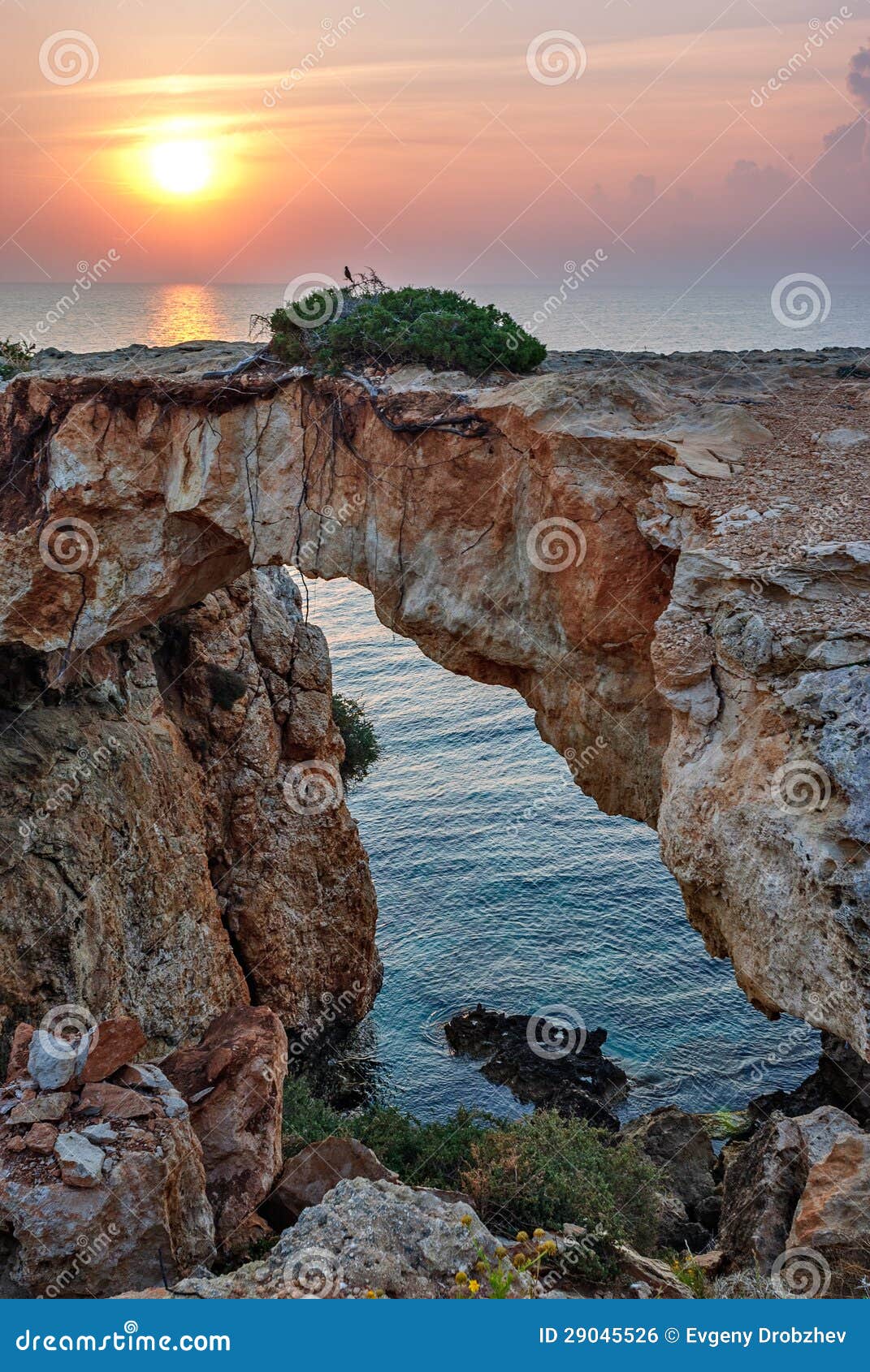Stone arch over coastline stock photo. Image of horizon - 29045526
