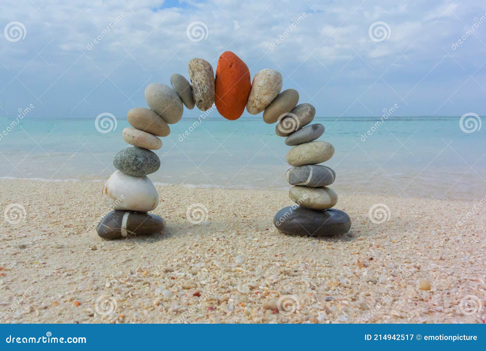 Stone Arch with Red Pebble at the Top at the Beach Stock Image - Image ...