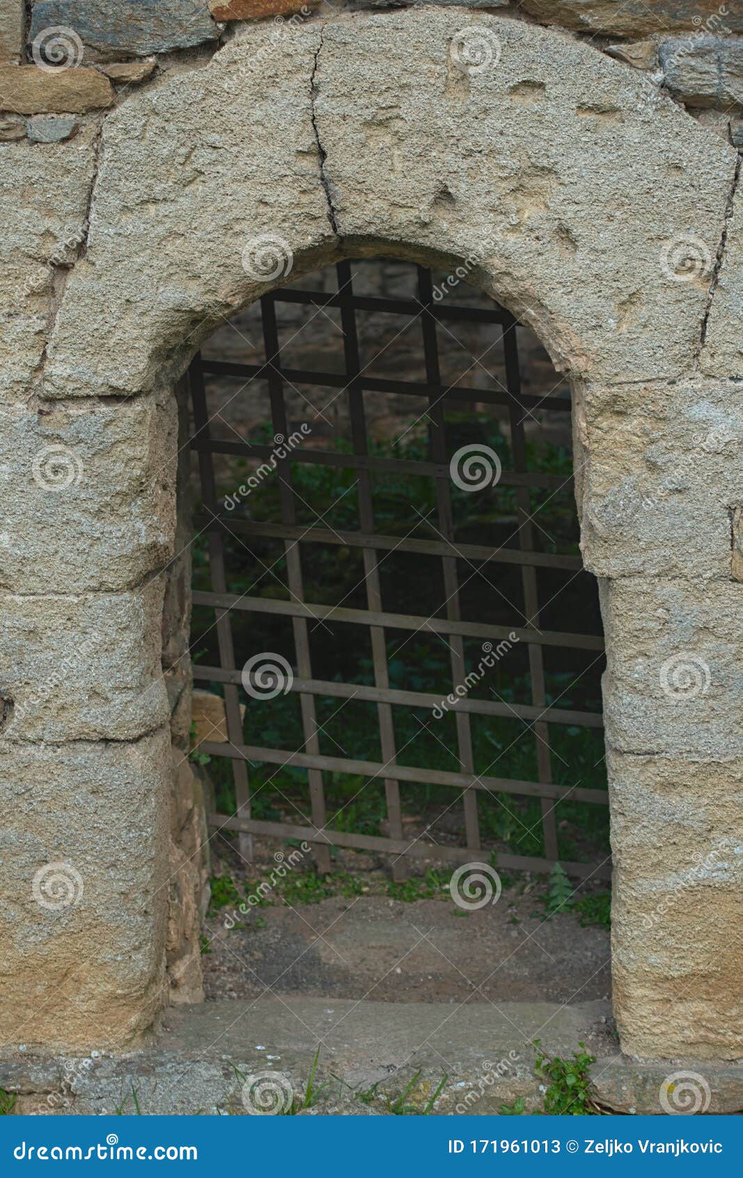 Stone Archway and Rustic Metal Gate Representing Dungeon Entrance Stock ...