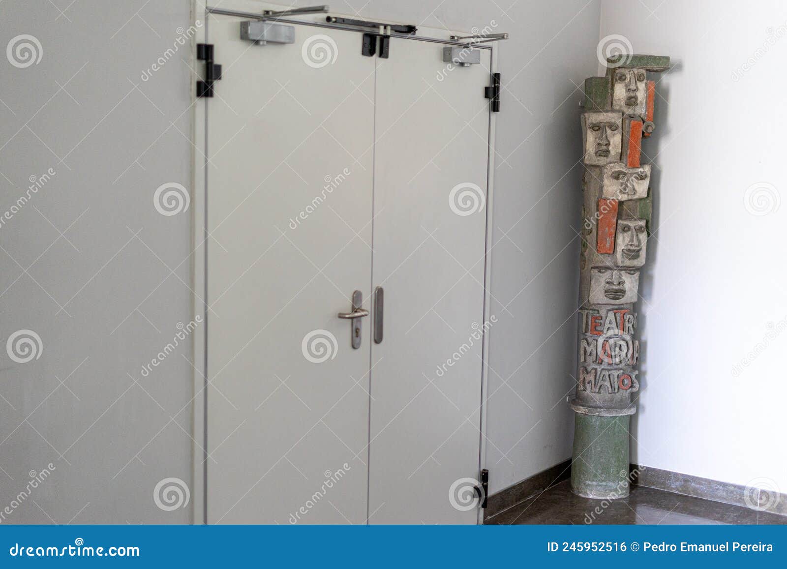 Stone Artwork of Human Faces Stacked in a Column. Editorial Photo ...