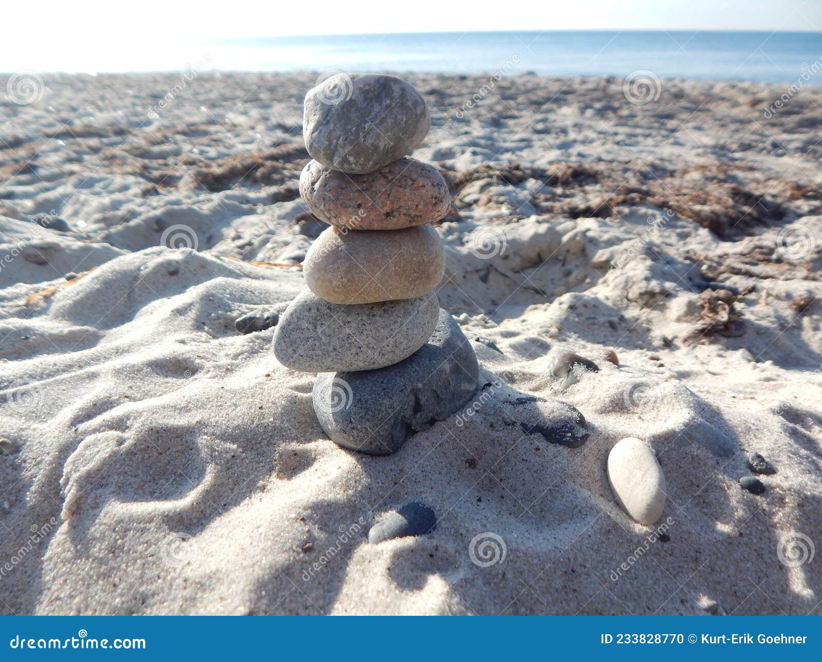 Stone balance on the beach stock photo. Image of water - 233828770