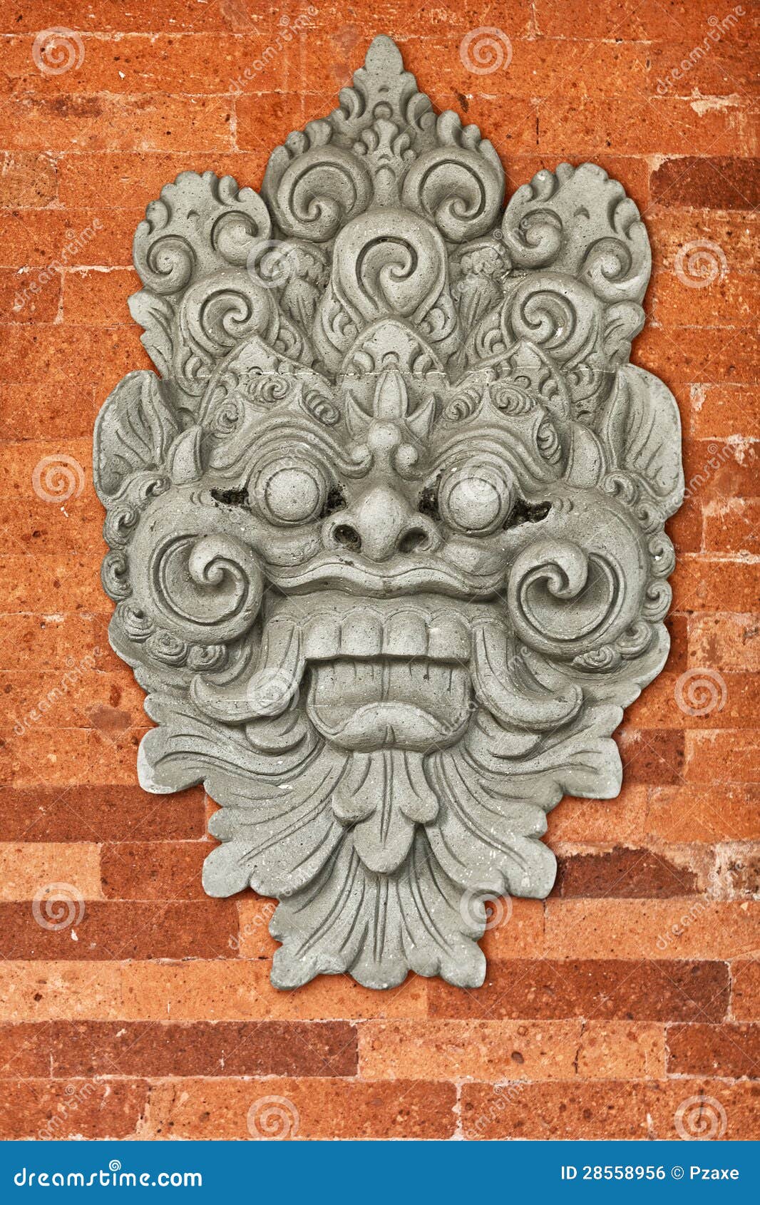 Stone Bas-relief on the Brick Wall. Indonesia, Bali. Stock Photo ...