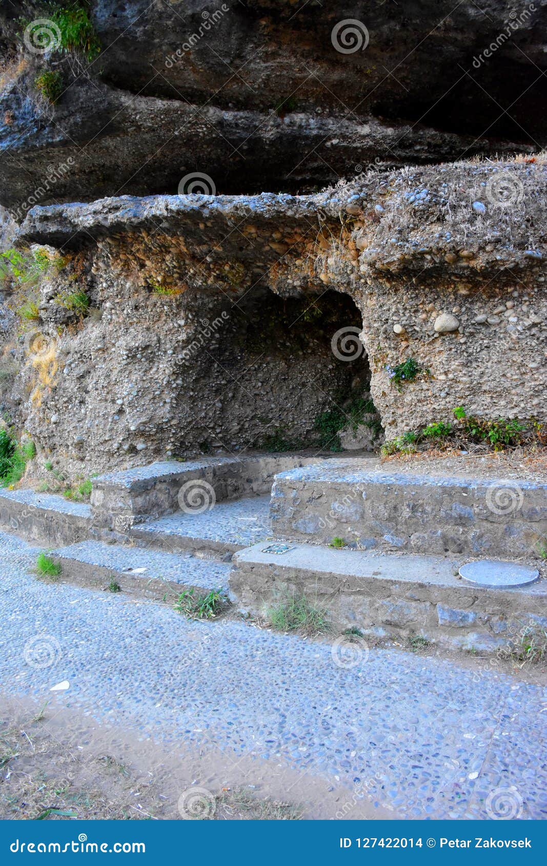 Stone bench in the cave stock photo. Image of bench - 127422014