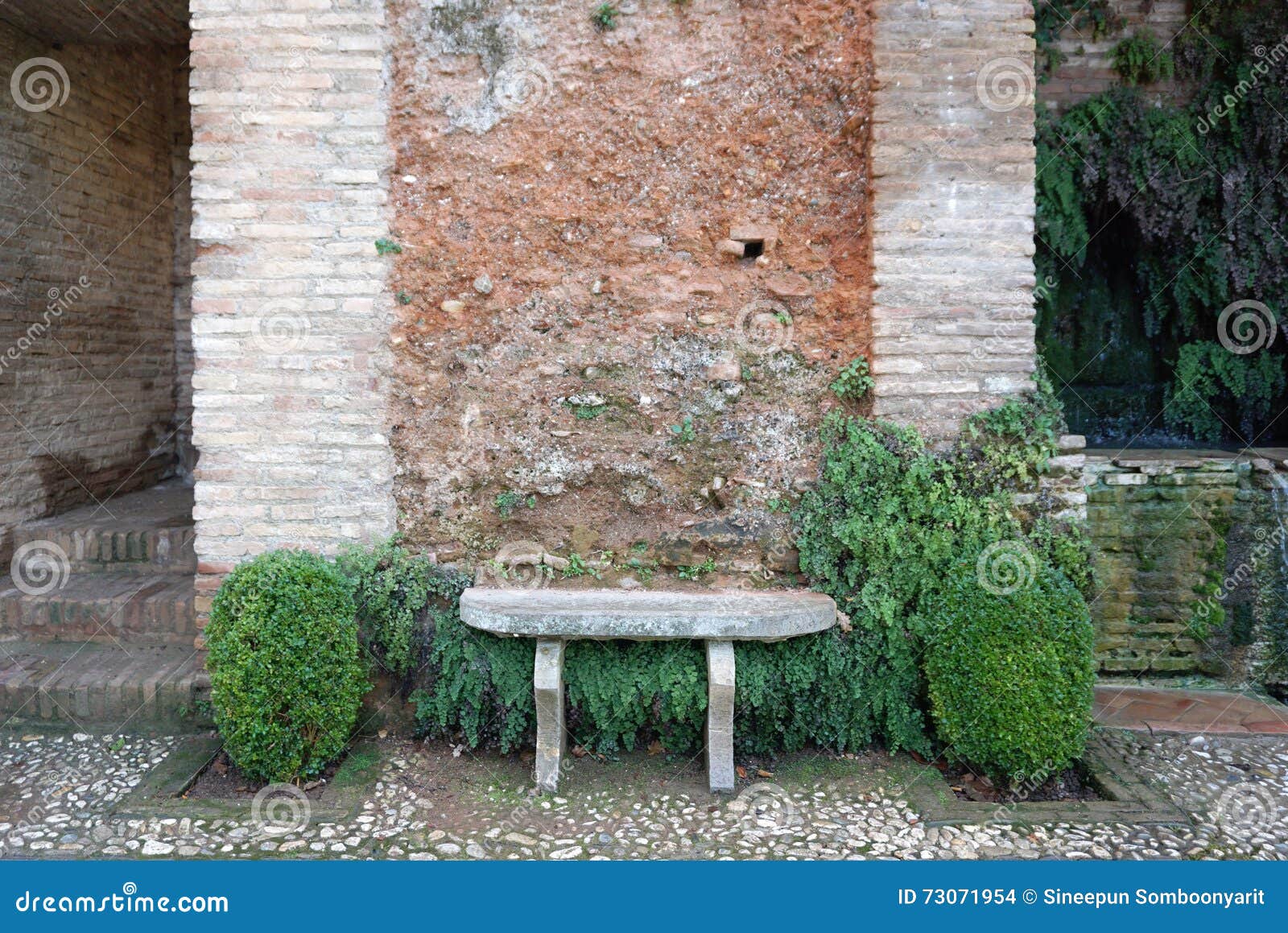 Stone Bench with Rustic Brick Wall Stock Photo - Image of rustic, stone ...
