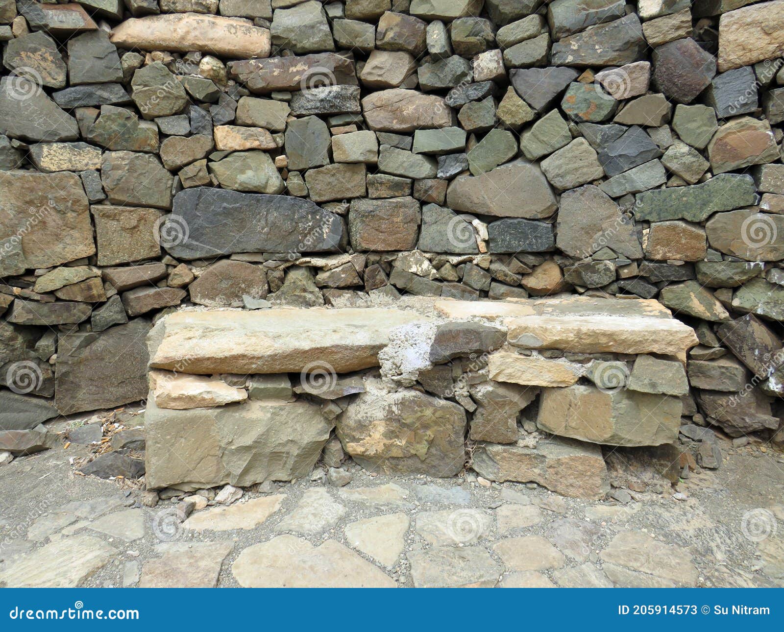 Stone Bench in a Wall of Rocks of Different Sizes and Shapes. Ancient ...