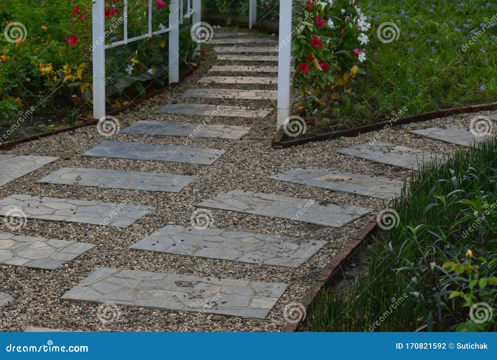 Stone Block Pathway in Flower Garden Stock Photo - Image of paving ...