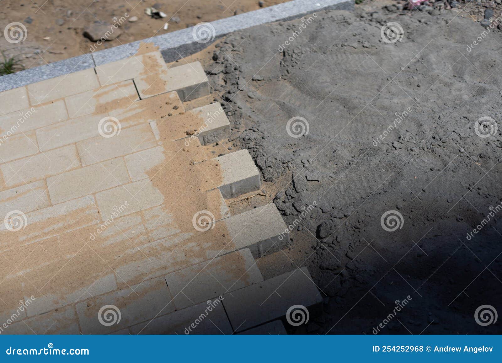 Stone Blocks Laying is on Sand Base. Sidewalk Device. Stock Photo ...