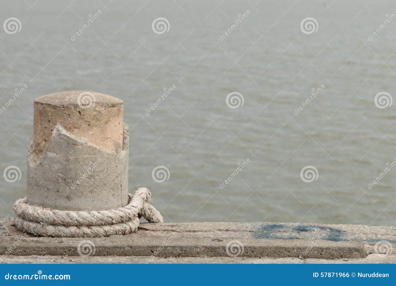 Stone Bollard with Rope on Boat Dock and Sea Stock Photo - Image of ...
