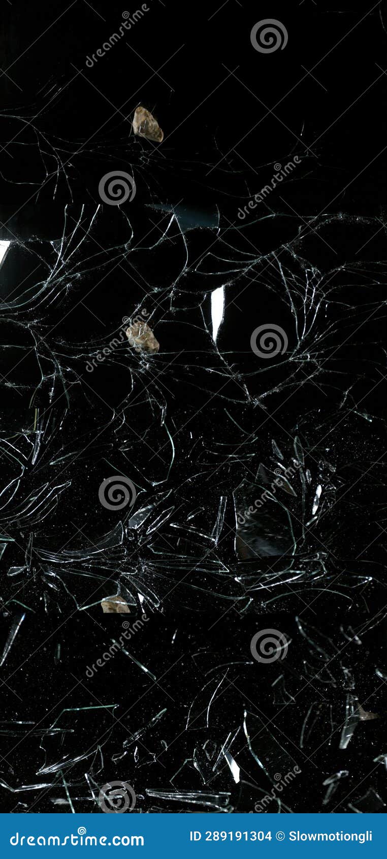 Stone Breaking Pane of Glass Against Black Background Stock Photo ...